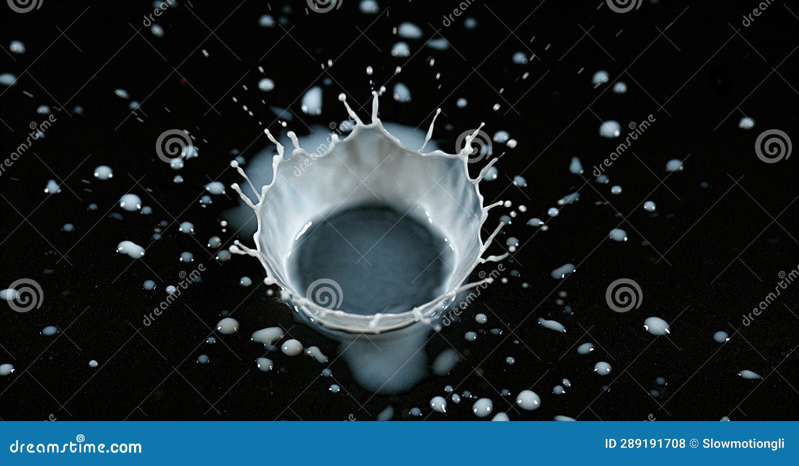 Drop of Milk Falling Against Black Background Stock Photo - Image of ...