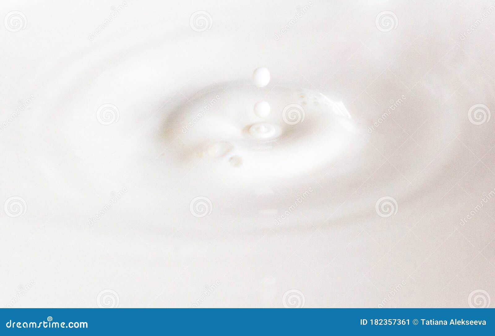 A Drop of Milk is Falling Down and Creating Waves, Splashes. Concept of ...