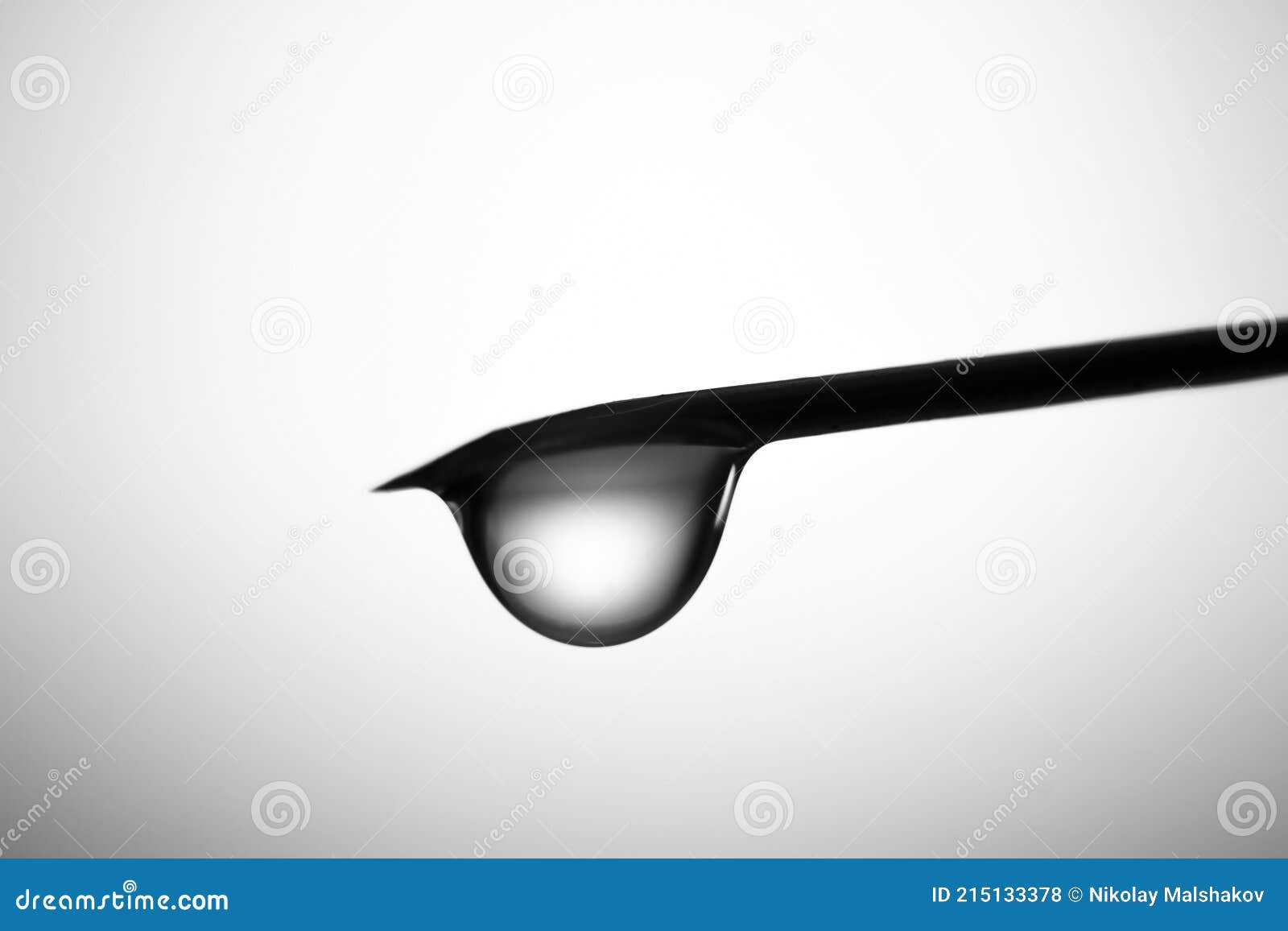 Drop on a Needle from a Syringe for Injections. Close Up on White ...