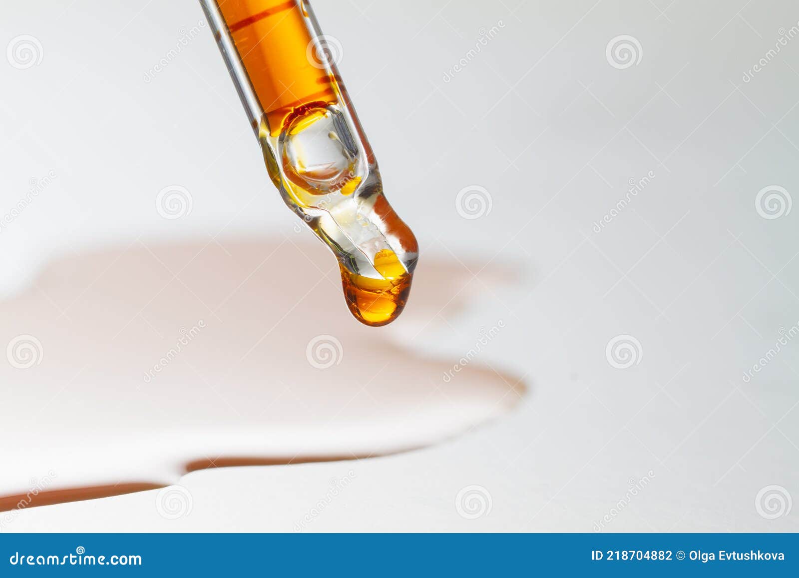 A Drop of Orange Oil on the Tip of a Glass Pipette Stock Photo - Image ...