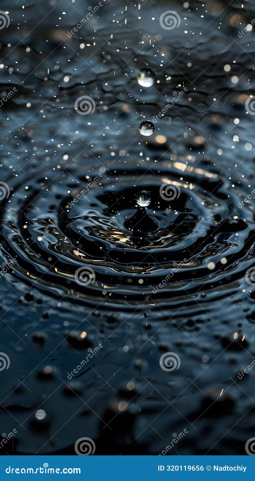 A Drop of Rain is Falling into a Puddle of Water Stock Photo - Image of ...