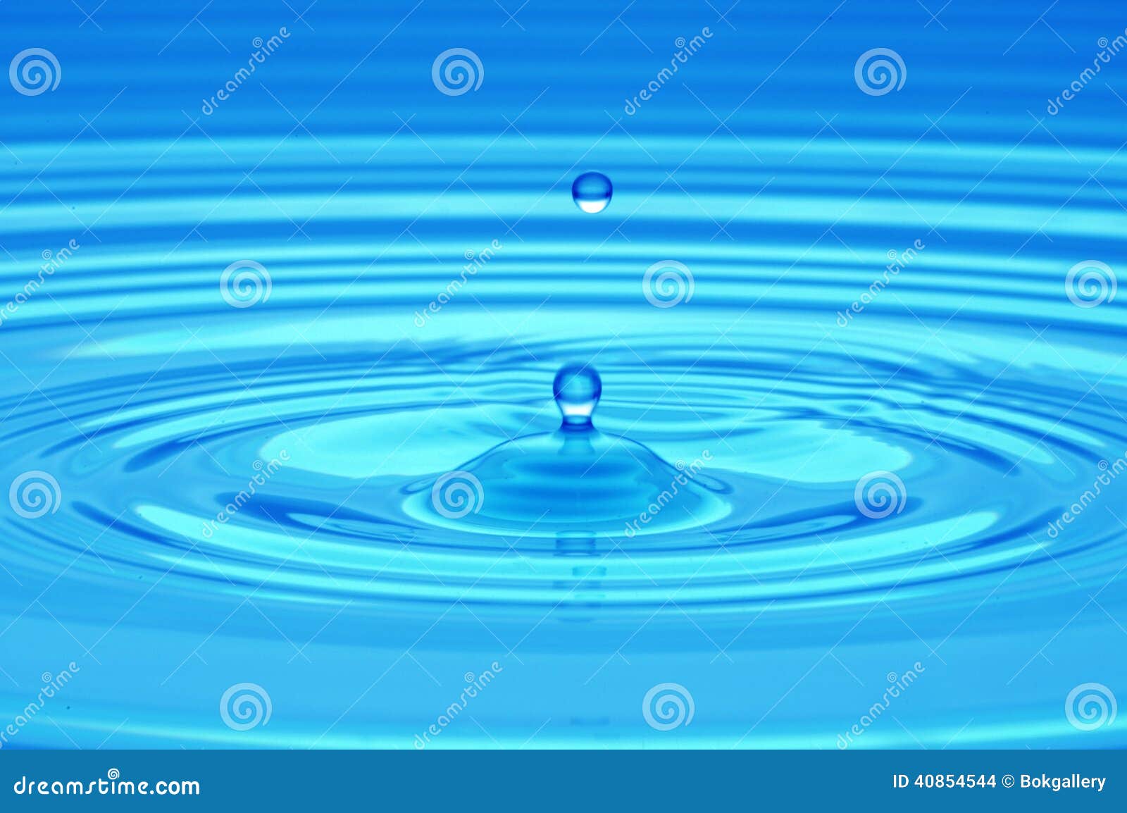 Drop of water in blue stock photo. Image of concept, effect - 40854544