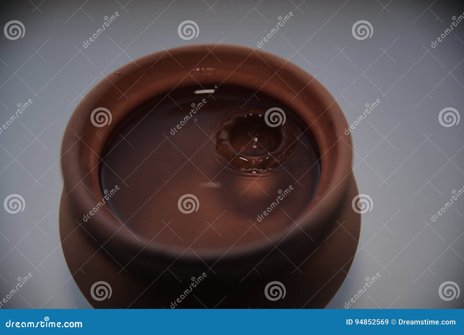 A Drop of Water in a Clay Pot Stock Image - Image of light, color: 94852569
