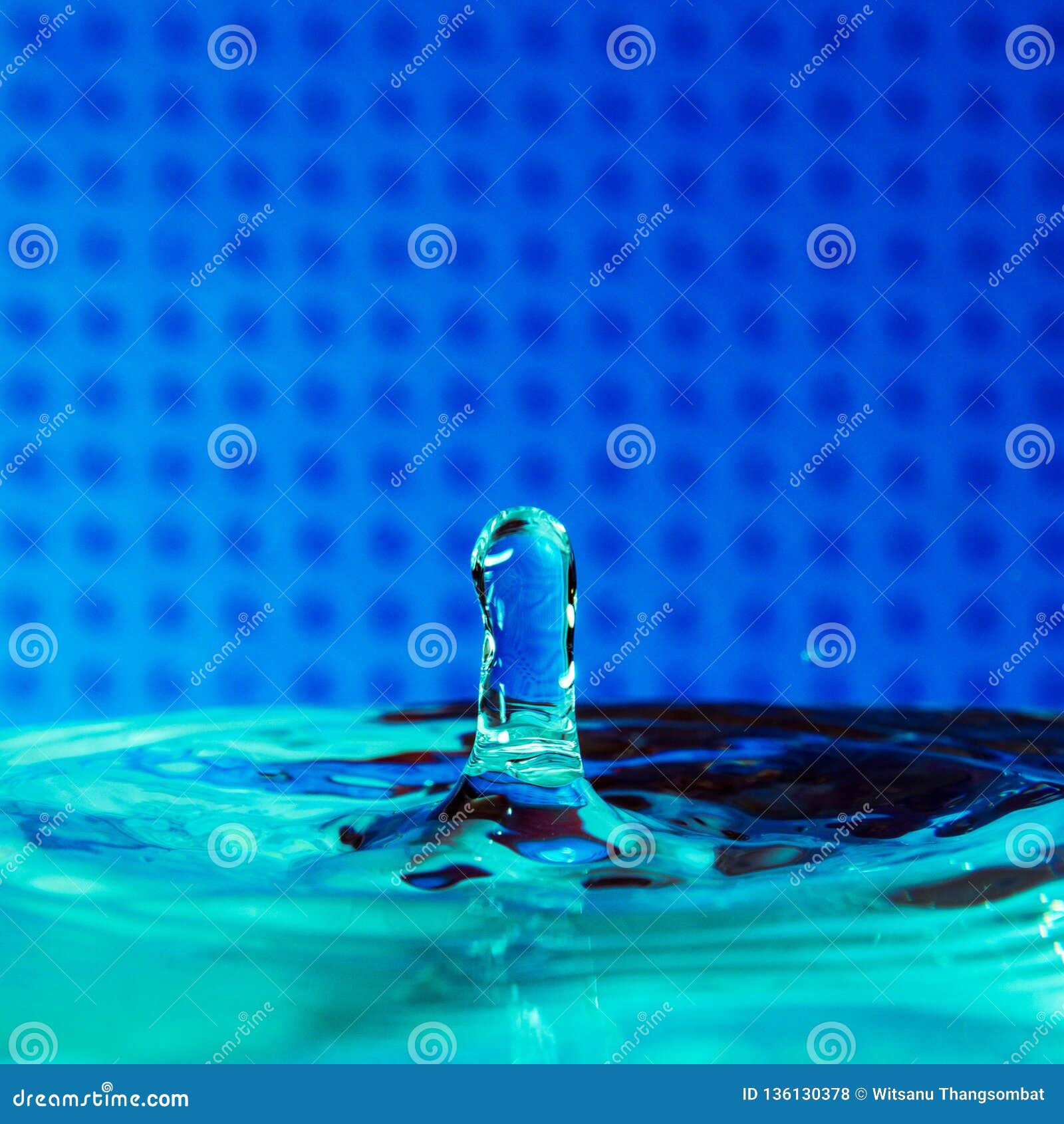 Drop of Water Falling in Blue Water and Blue Background Stock Photo ...