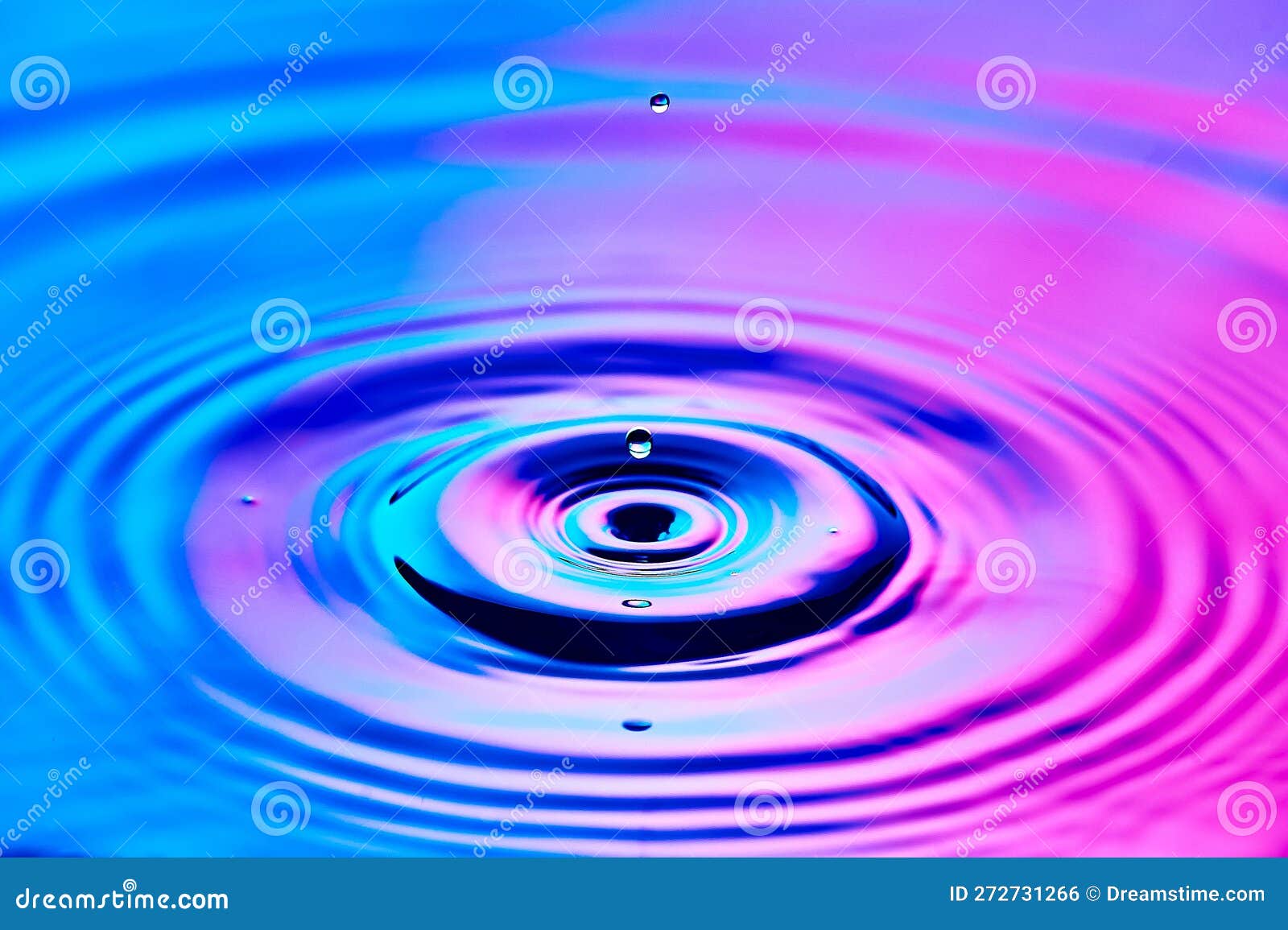 A Drop of Water Falling into the Water and Creating Waves Stock Photo ...