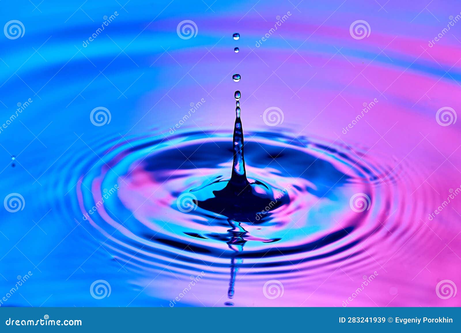 A Drop of Water Falling into the Water and Creating Waves Stock Image ...