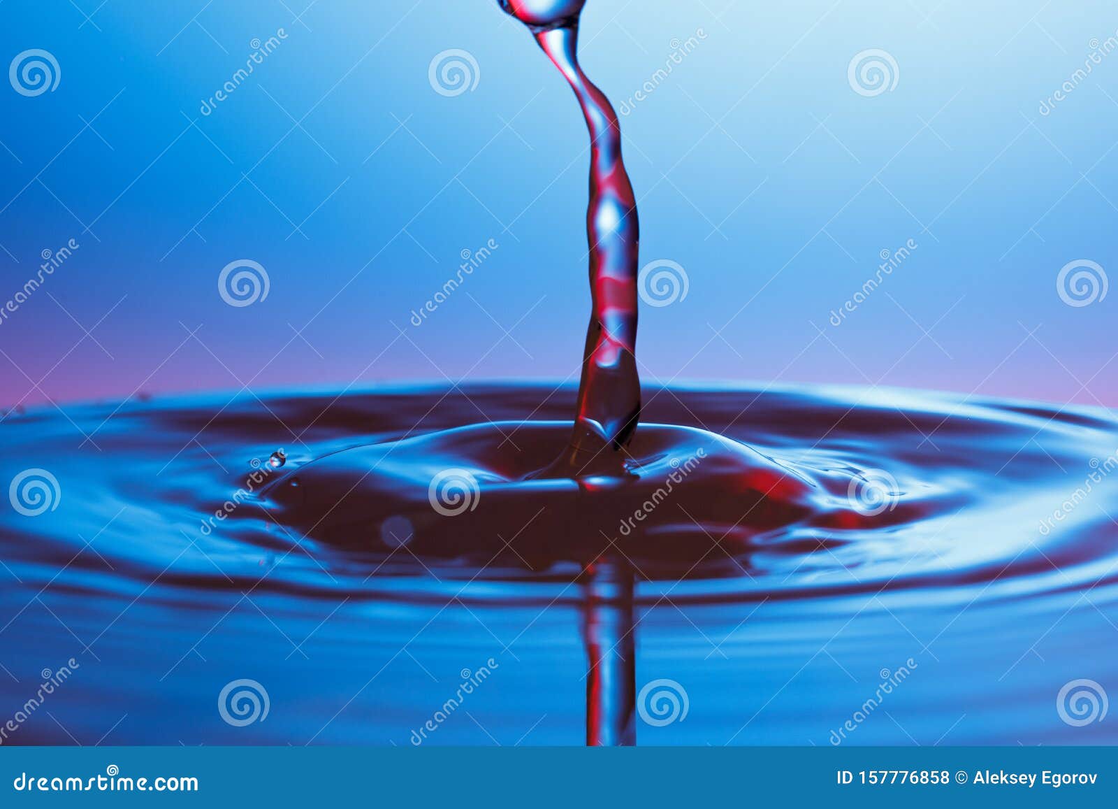 Drop of Water Falling Down in the Water Stock Photo - Image of colored ...