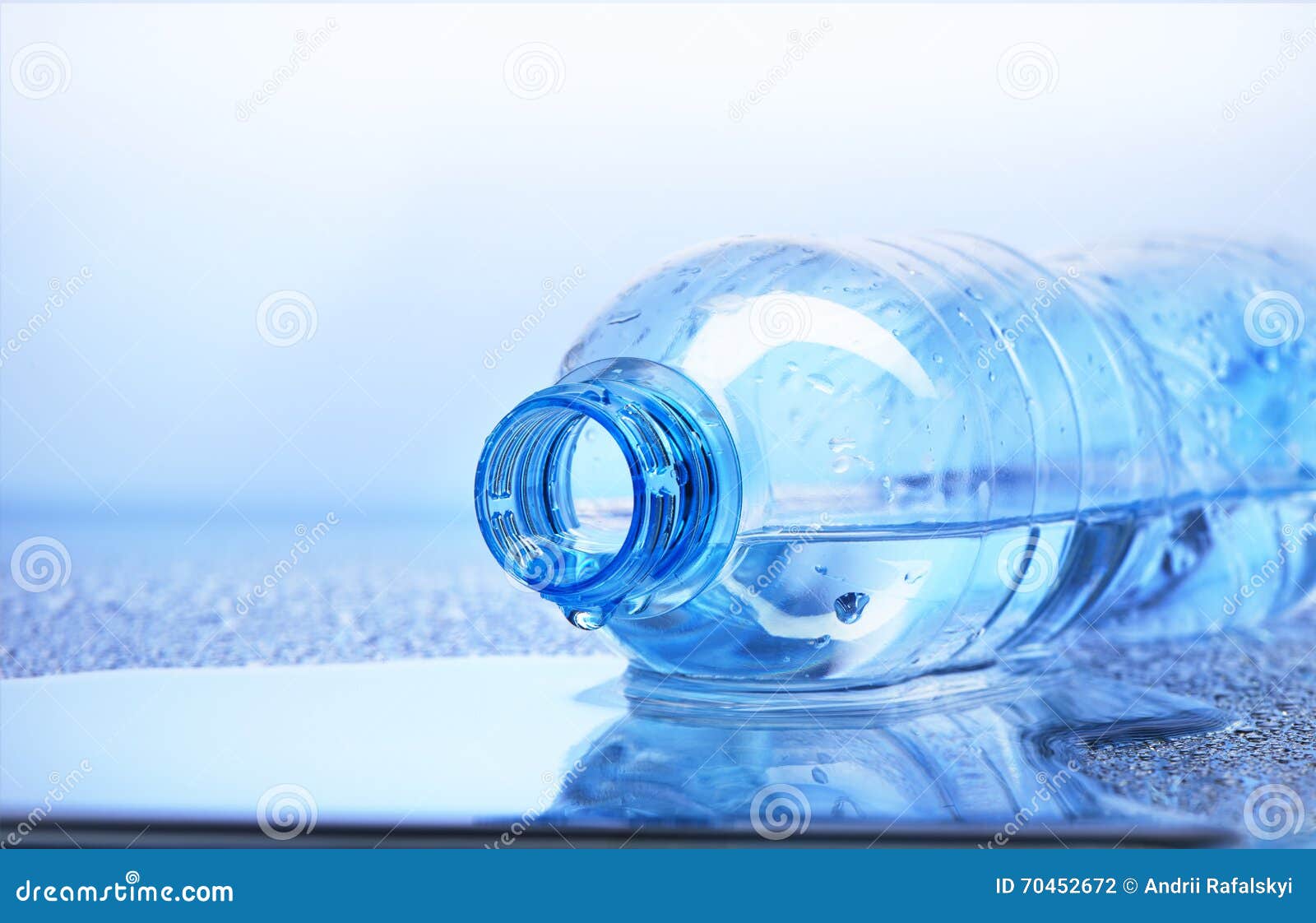 Drop Of Water Falling From Plastic Bottle With Reflection Stock Photo ...