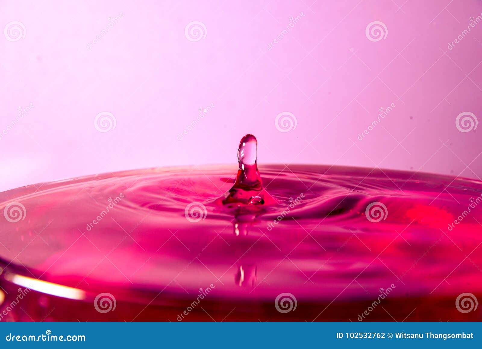 Drop of Water Falling in Red Water and Red Background. Stock Photo ...