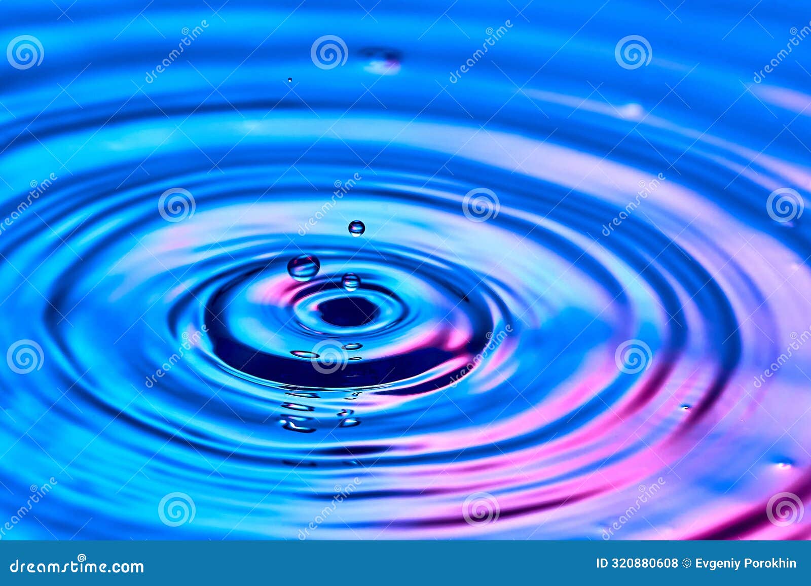 A Drop of Water Falling into the Water and Creating Waves Stock Photo ...