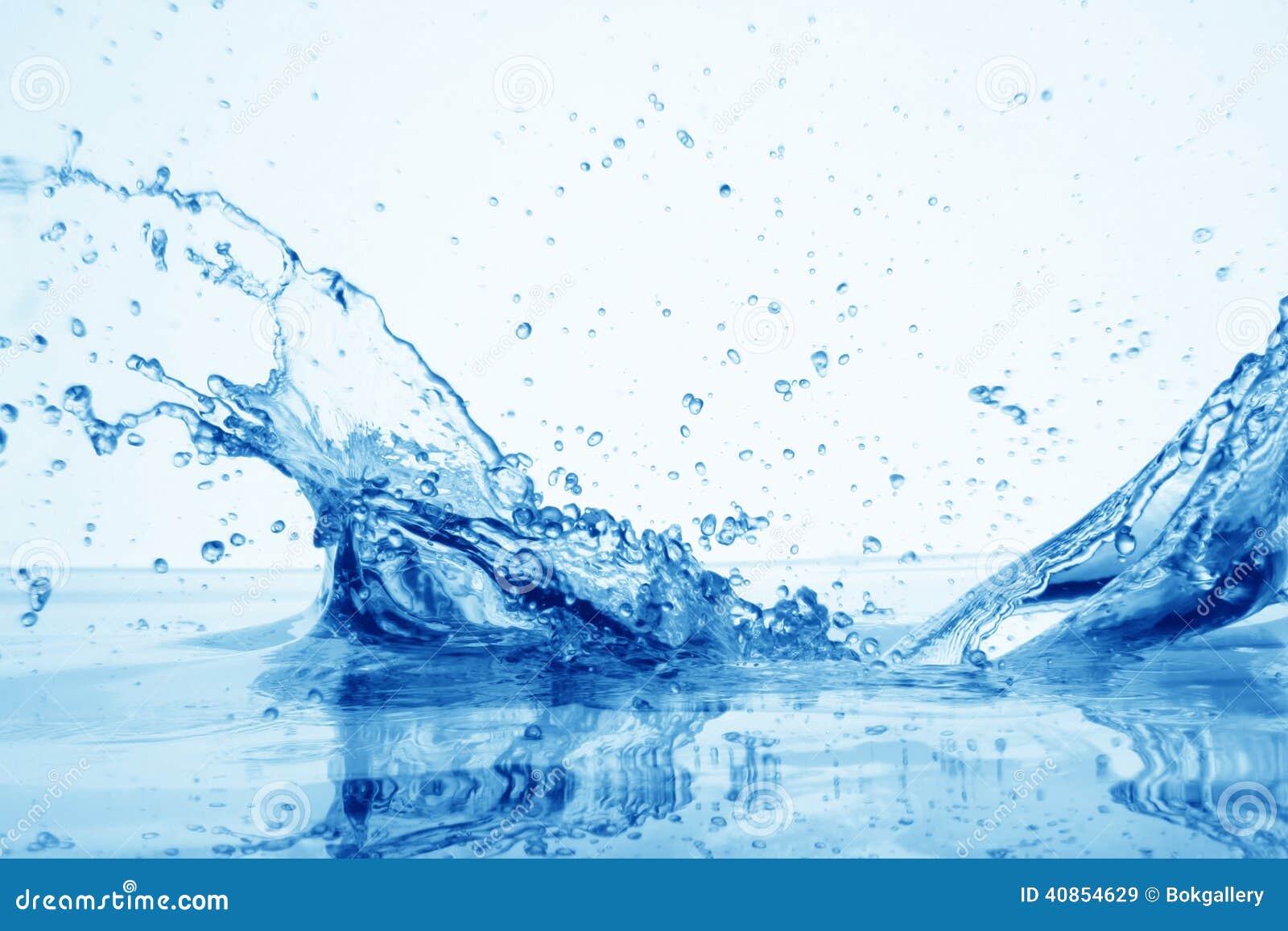 Drop Of Water In Puddle In Blue Stock Photo - Image: 40854629