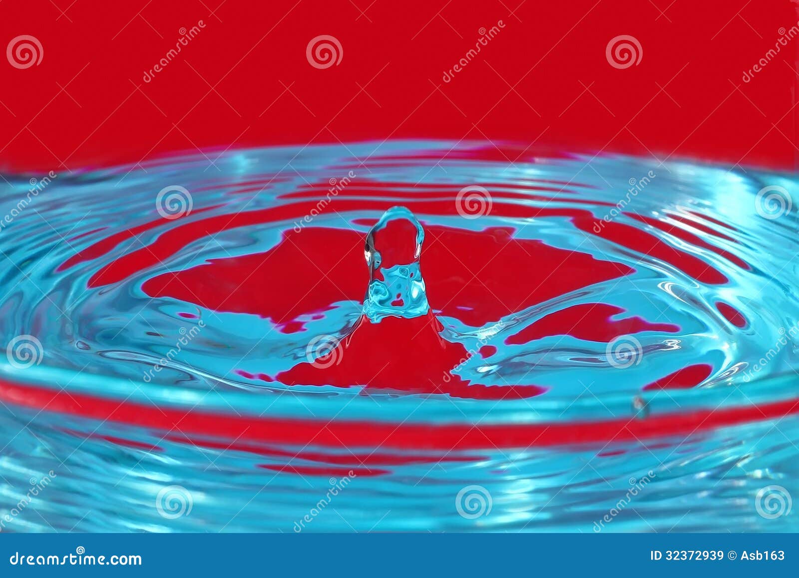 A Drop Of Water In The Red-blue Color Stock Image - Image of water ...