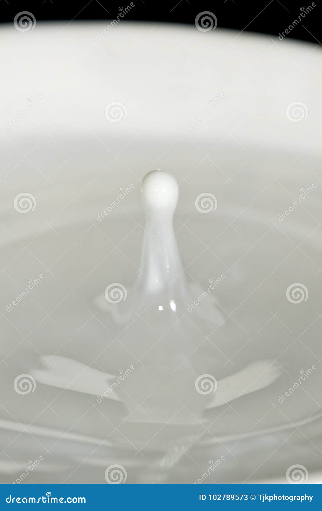 Droplet of Milk Falling in To a Cup of Milk Stock Image - Image of ...