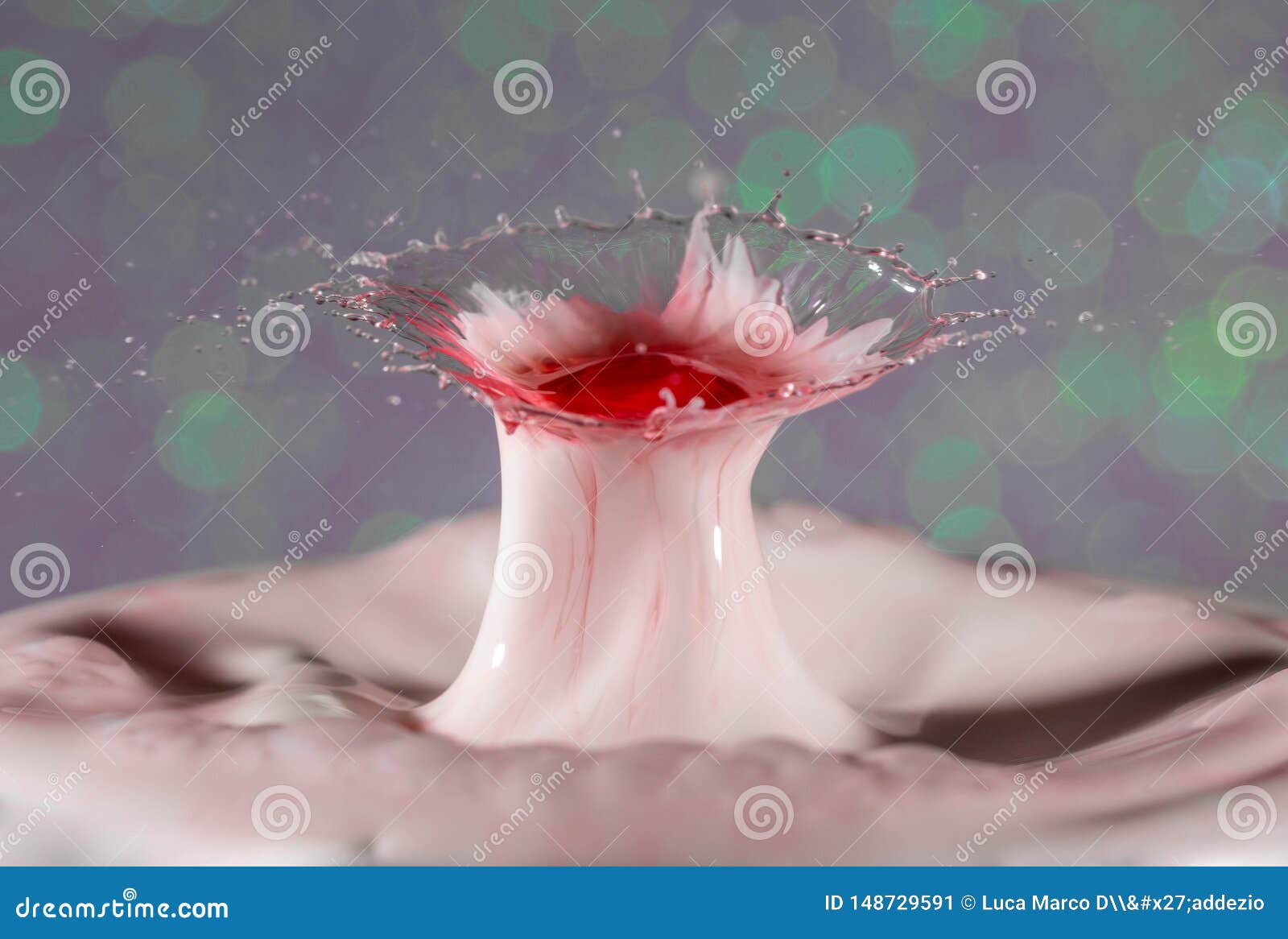 Droplet Photography: a Red Drop Falling into the White Liquid Stock ...