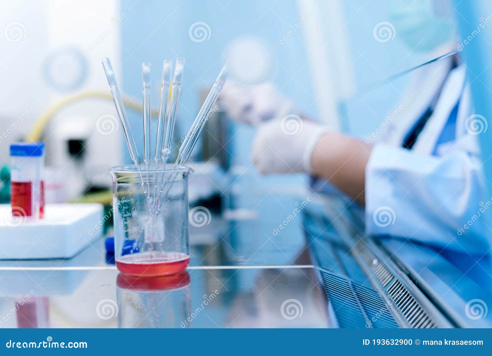 Dropper Pipette In Beaker And Scientist Using Dropper Pipette Transfer ...