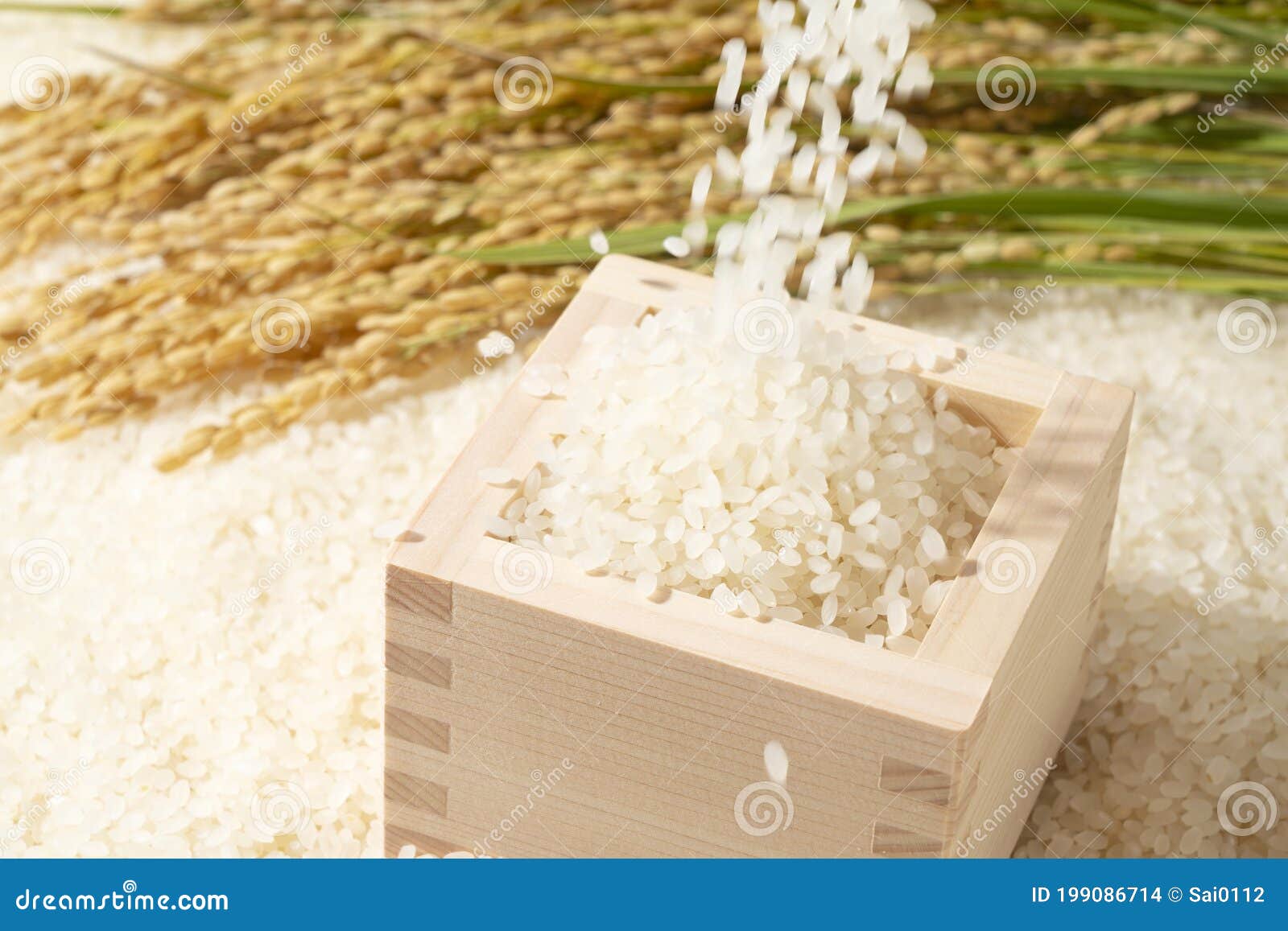 Dropping Rice Onto the White Rice and Squares Laid Out Stock Photo ...