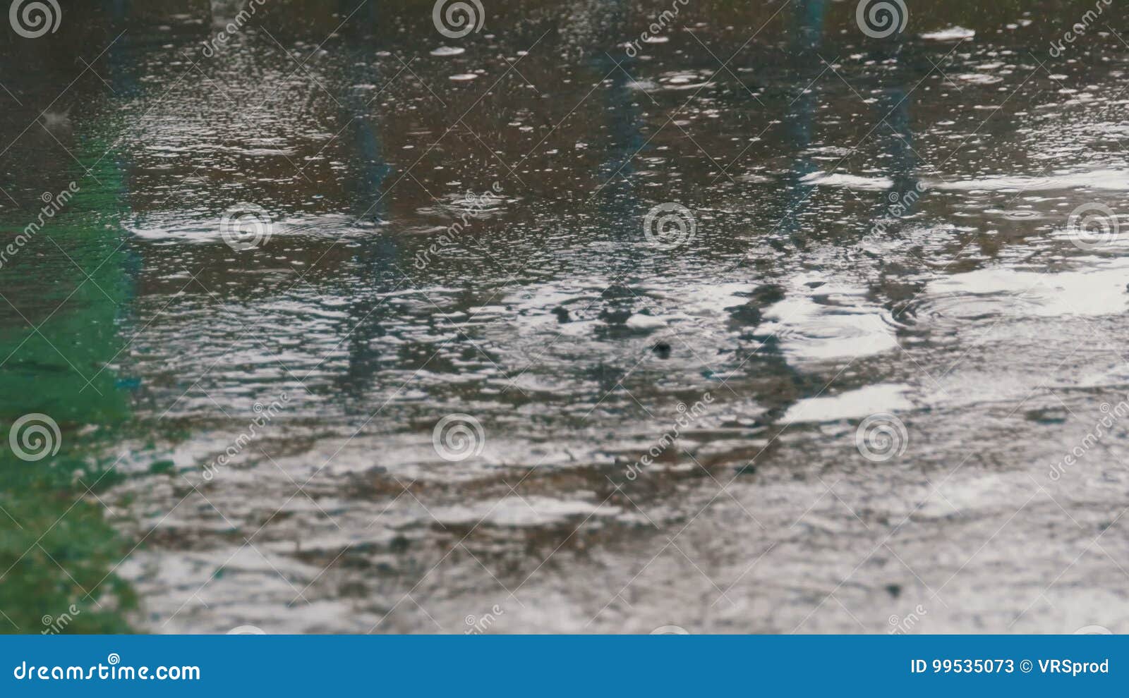 Drops of Rain Fall To the Pavement Forming a Puddle Stock Video - Video ...
