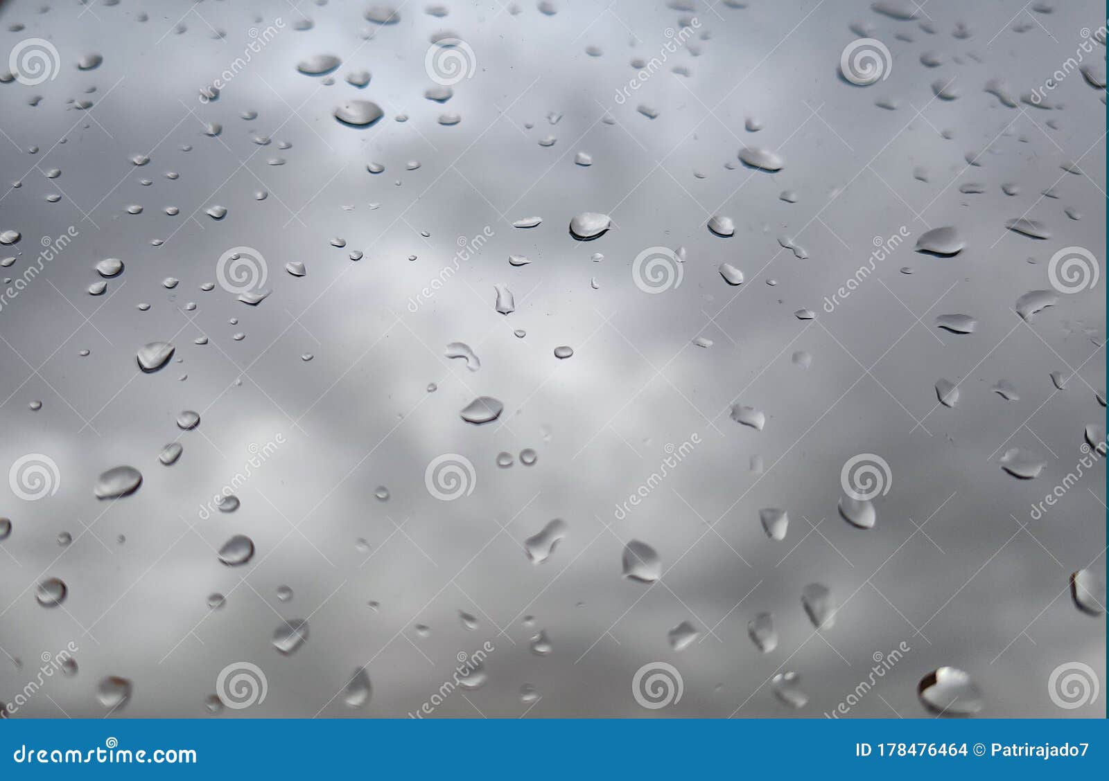 Drops of Rain on the Window that Reveal a Background of Gray Clouds ...