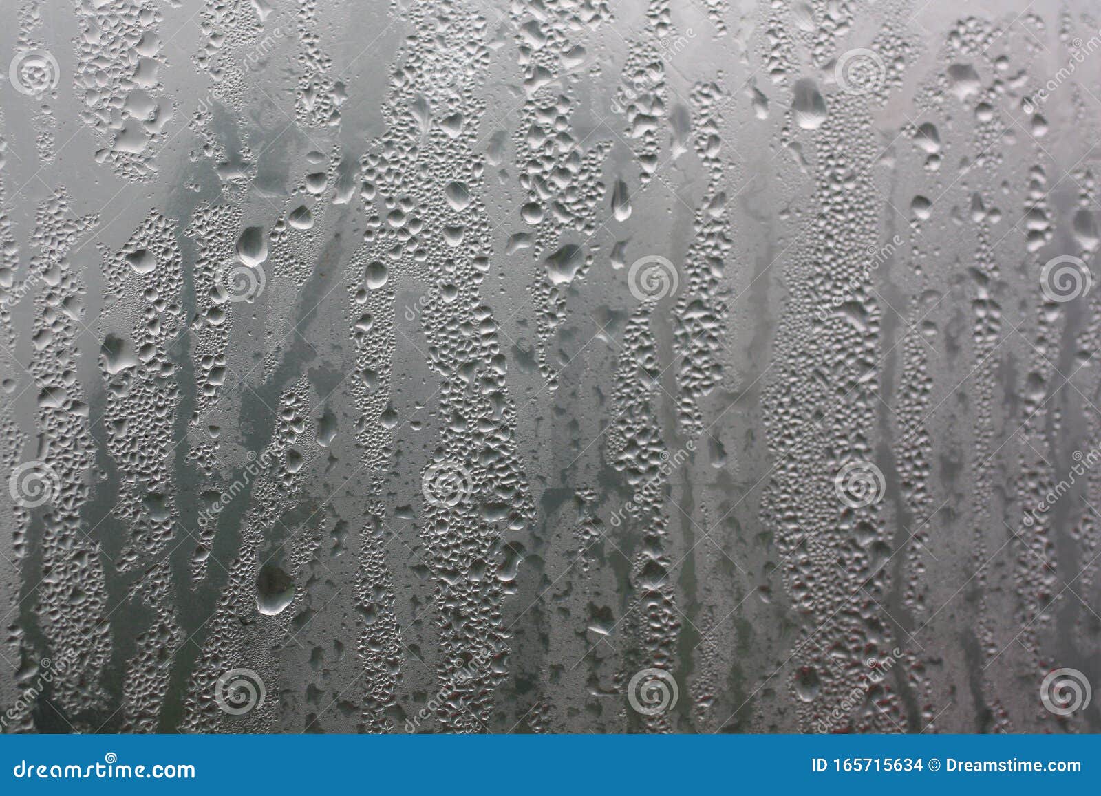 Drops of Water Flow Down a Translucent Surface. Background Texture ...