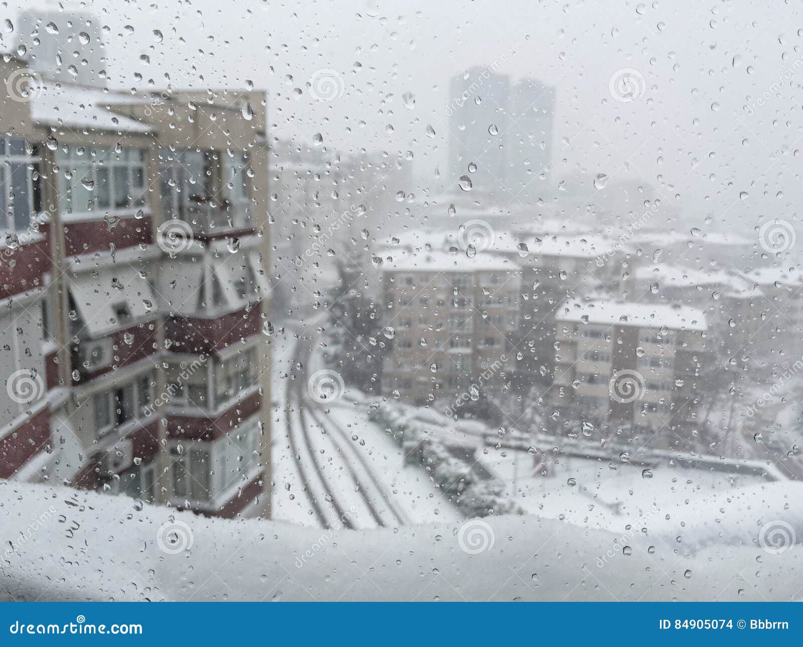 Drops on Window Against City View Under Snow Stock Photo - Image of ...