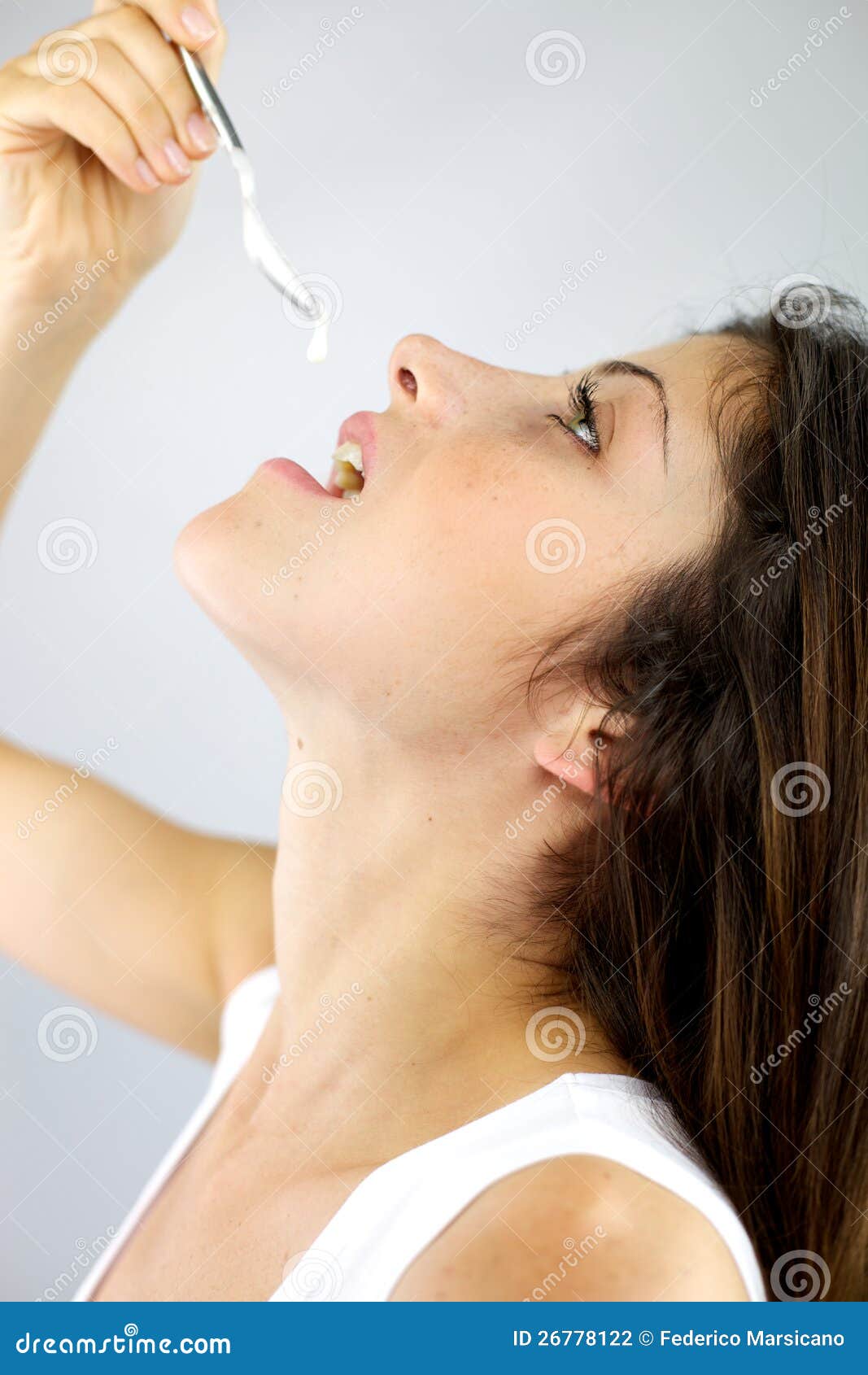 Drops of Yogurt Fall in Mouth of Beautiful Woman Stock Photo - Image of ...