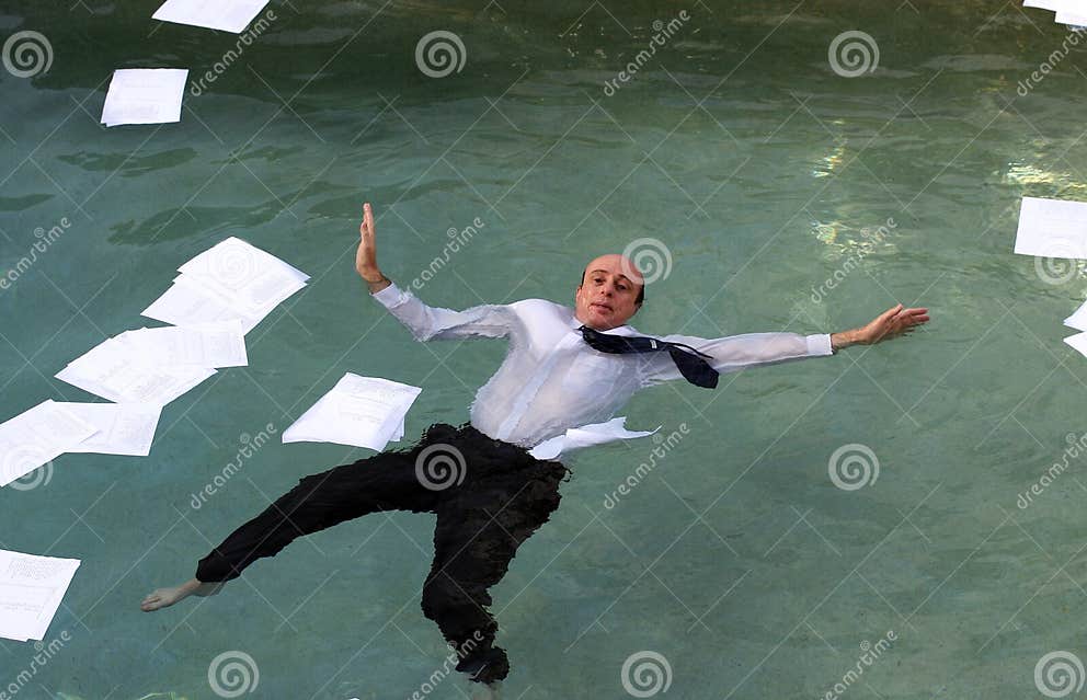 Drowning in paperwork stock photo. Image of sink, businessman - 2286560