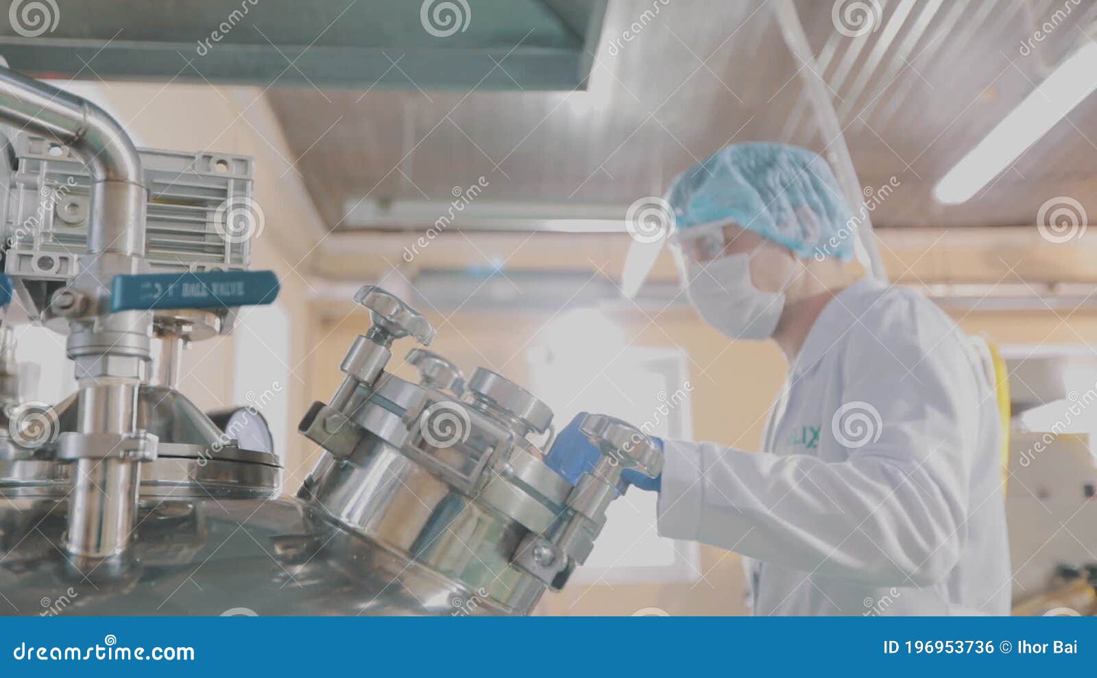 Masked People Work in a Factory. Drug Manufacturing Process. Inside the ...