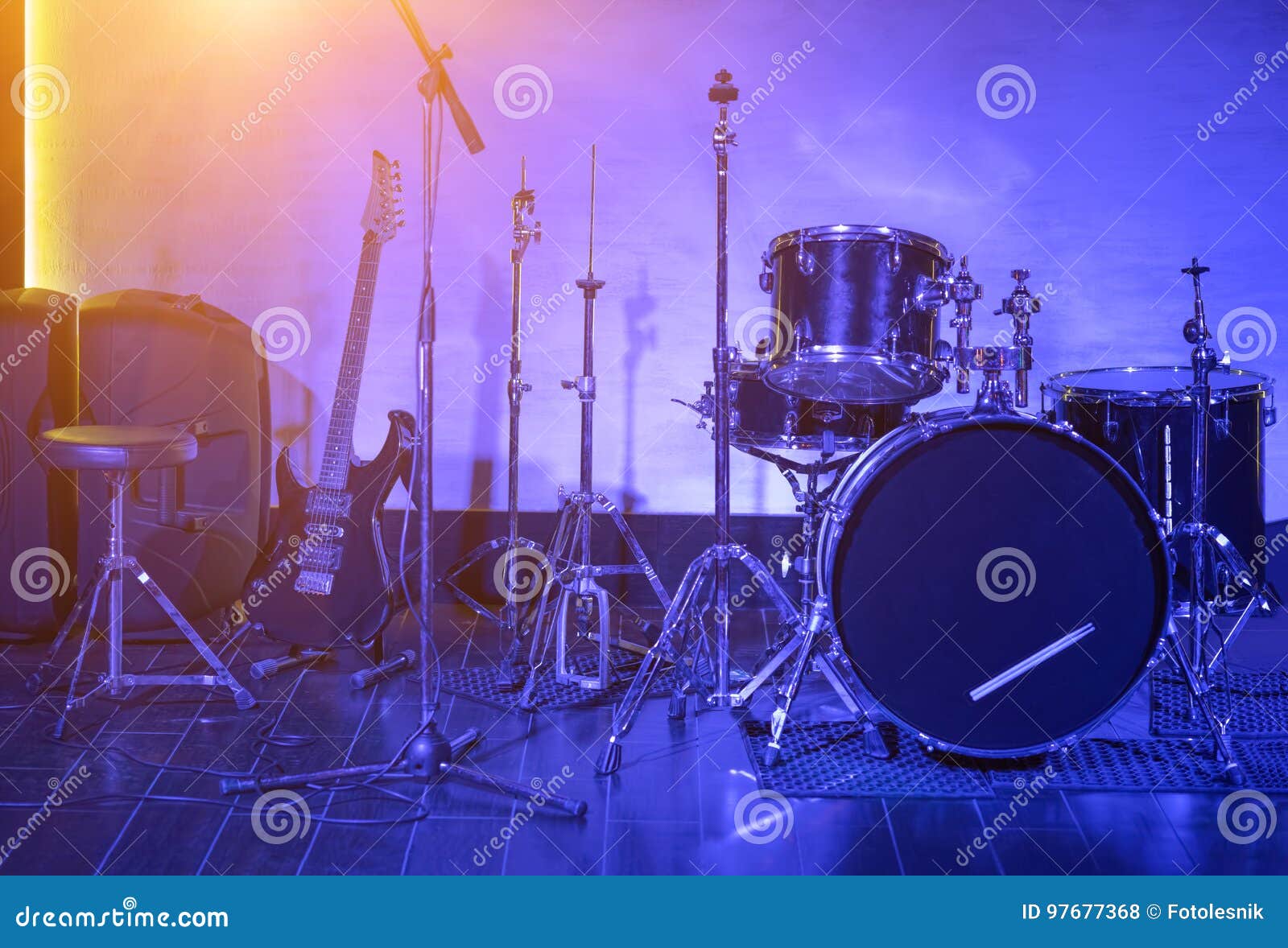 Drum Kit and Guitar in Blue Light Closeup Stock Photo - Image of ...