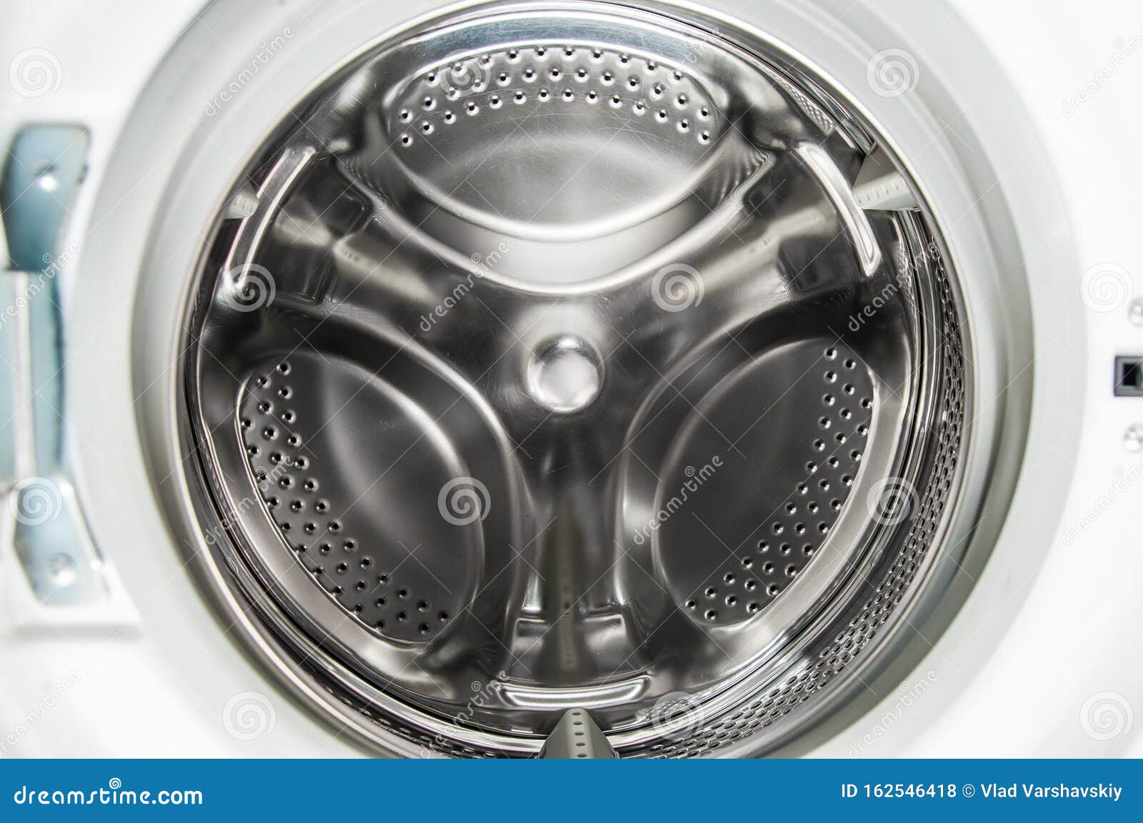 The Drum of an Open Washing Machine with a Glass Side Door. Side ...