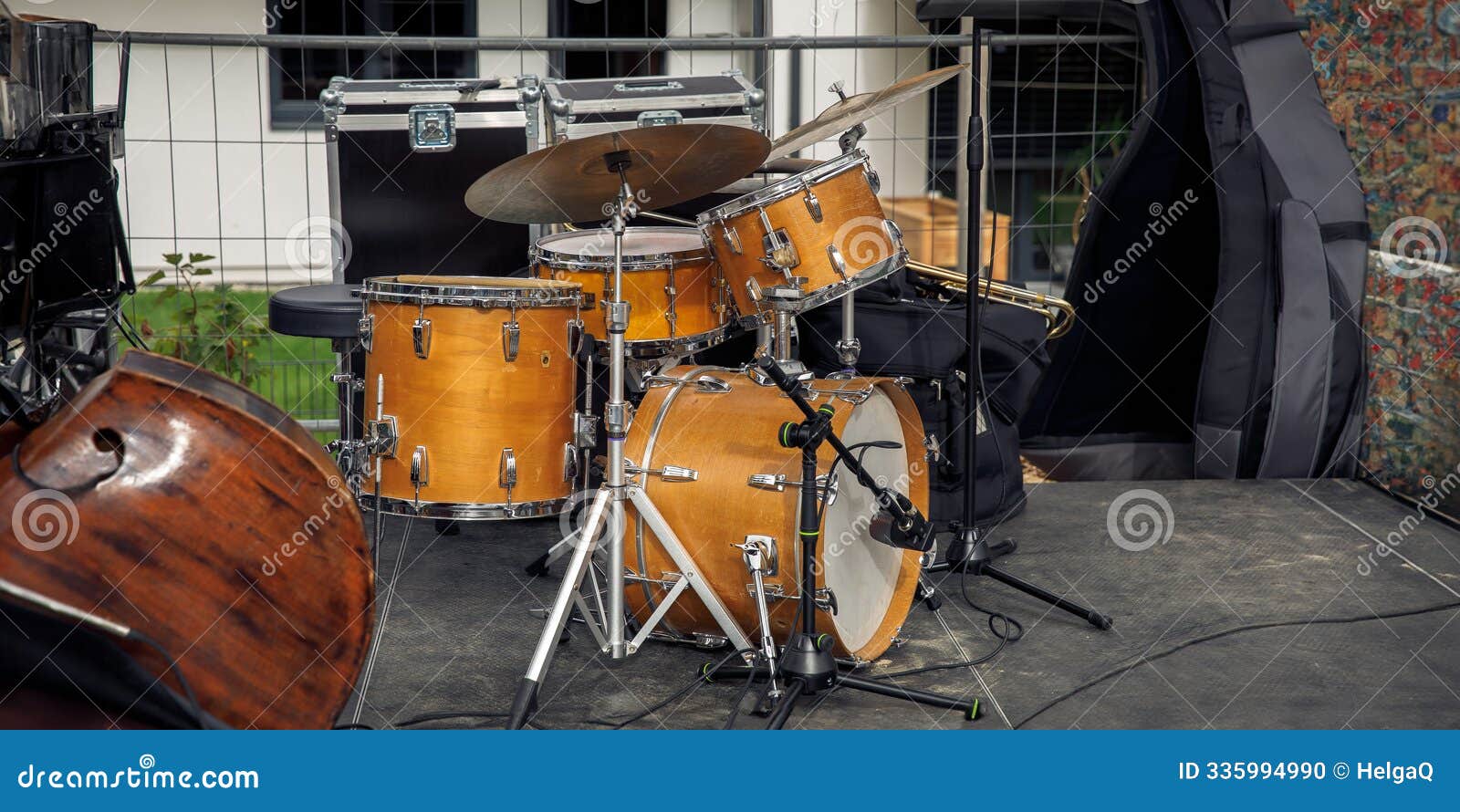 Drum Set on Outdoor Stage with Closed Double Bass Case, Musical ...