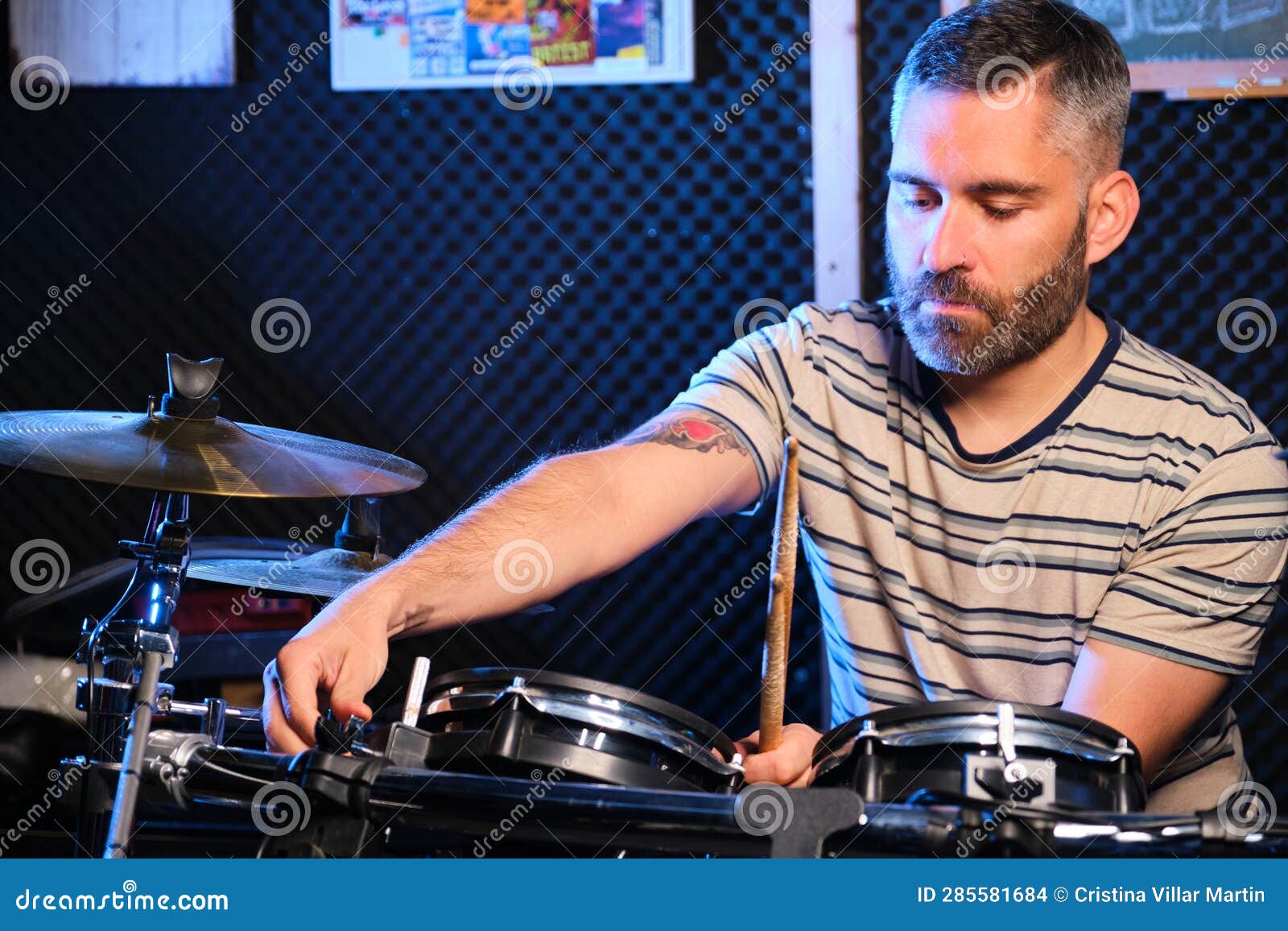 Drummer Man Adjusting a Drum in a Drum Set in a Recording Studio. Stock ...
