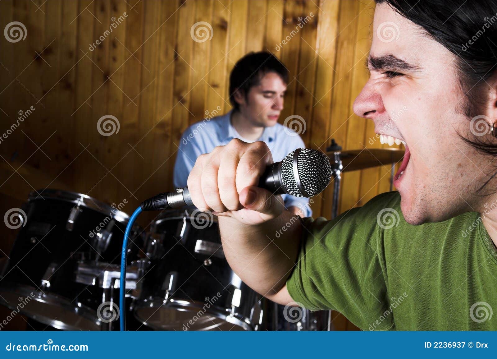 Drummer and rock singer stock image. Image of playing - 2236937