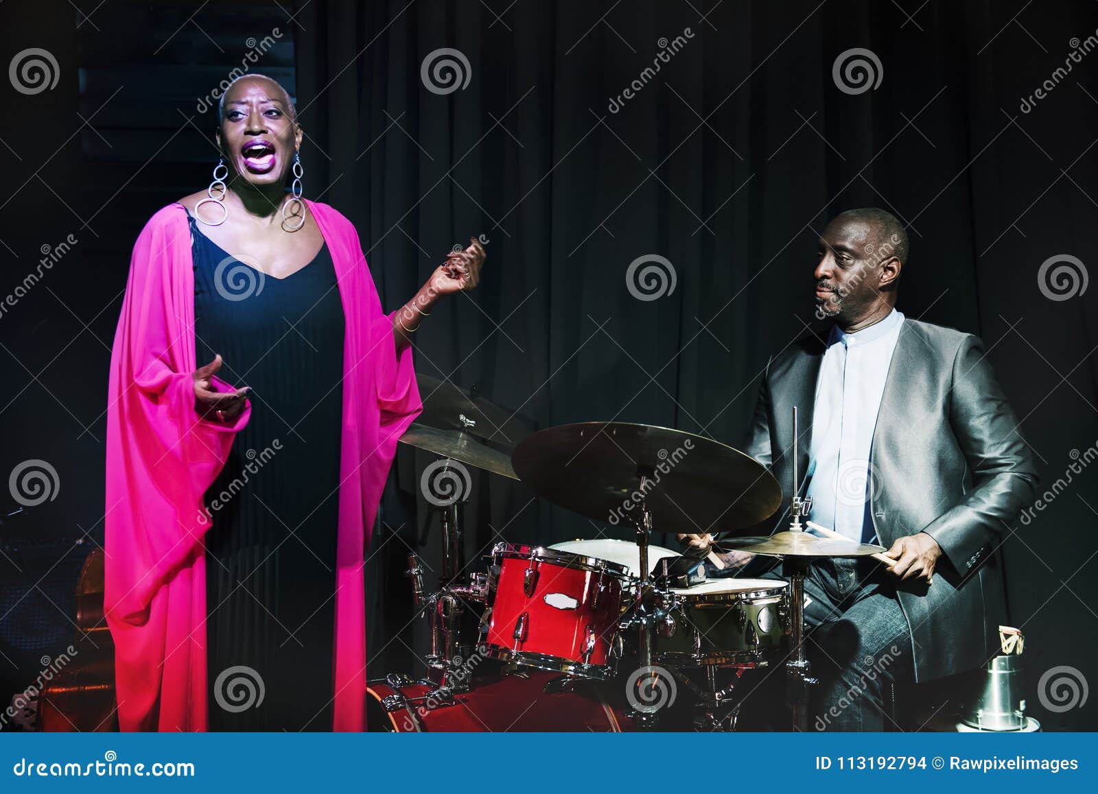 Drummer and Singer Performing in an Event Stock Photo - Image of person ...