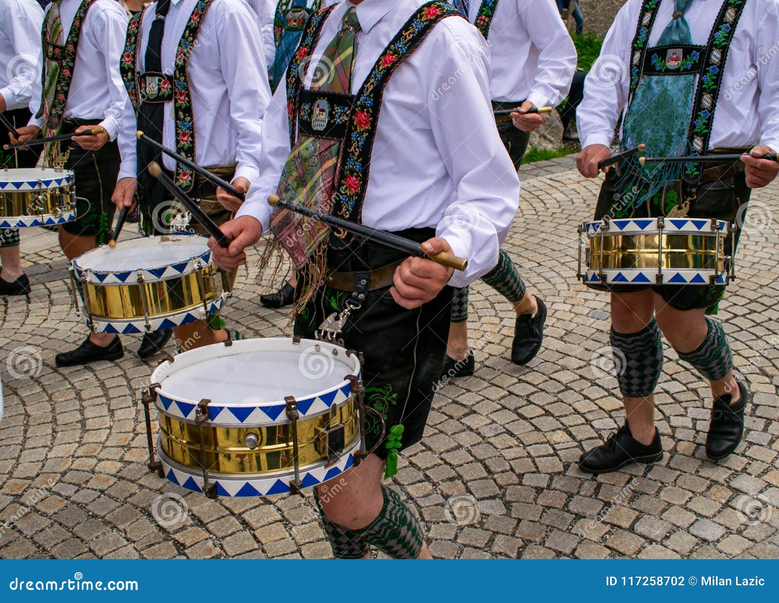 Drummers in Traditional Clothes Pull Drums through the City Stock Photo ...