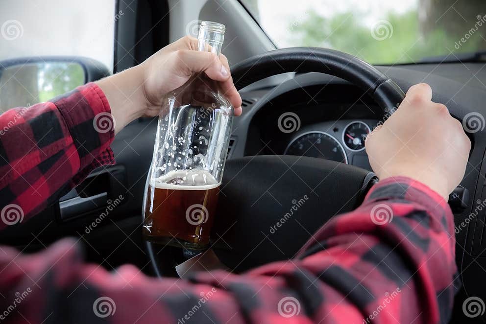 Drunk Driver Behind the Wheel. Man Drinking in the Car. Alcohol Problem ...