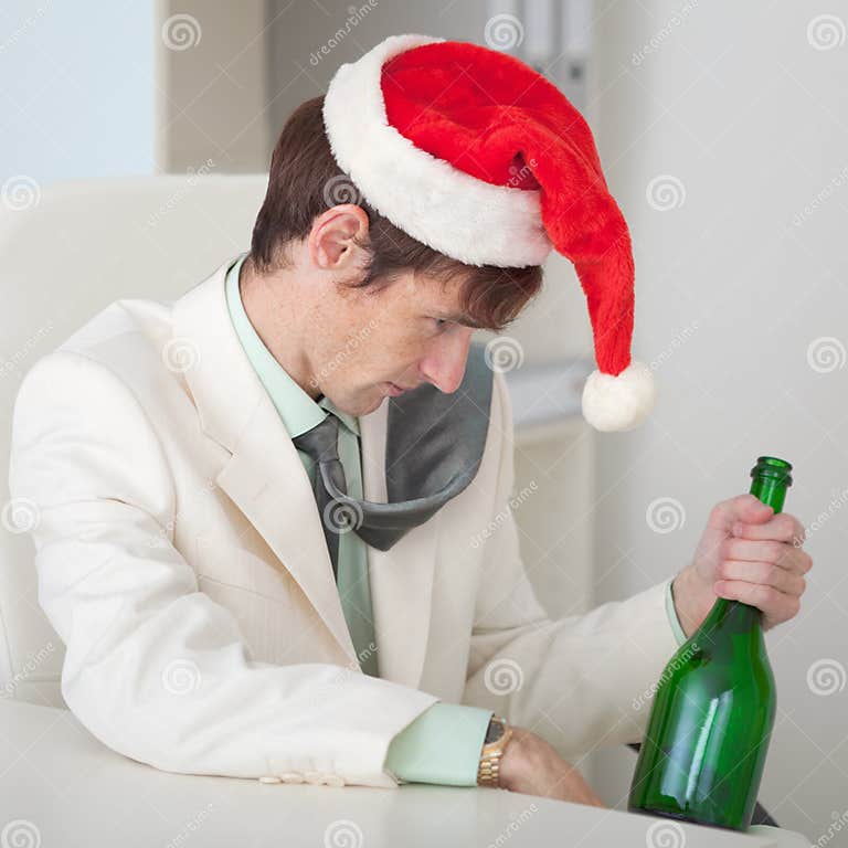 Drunk Man in a Christmas Cap with Bottle Stock Image - Image of people ...