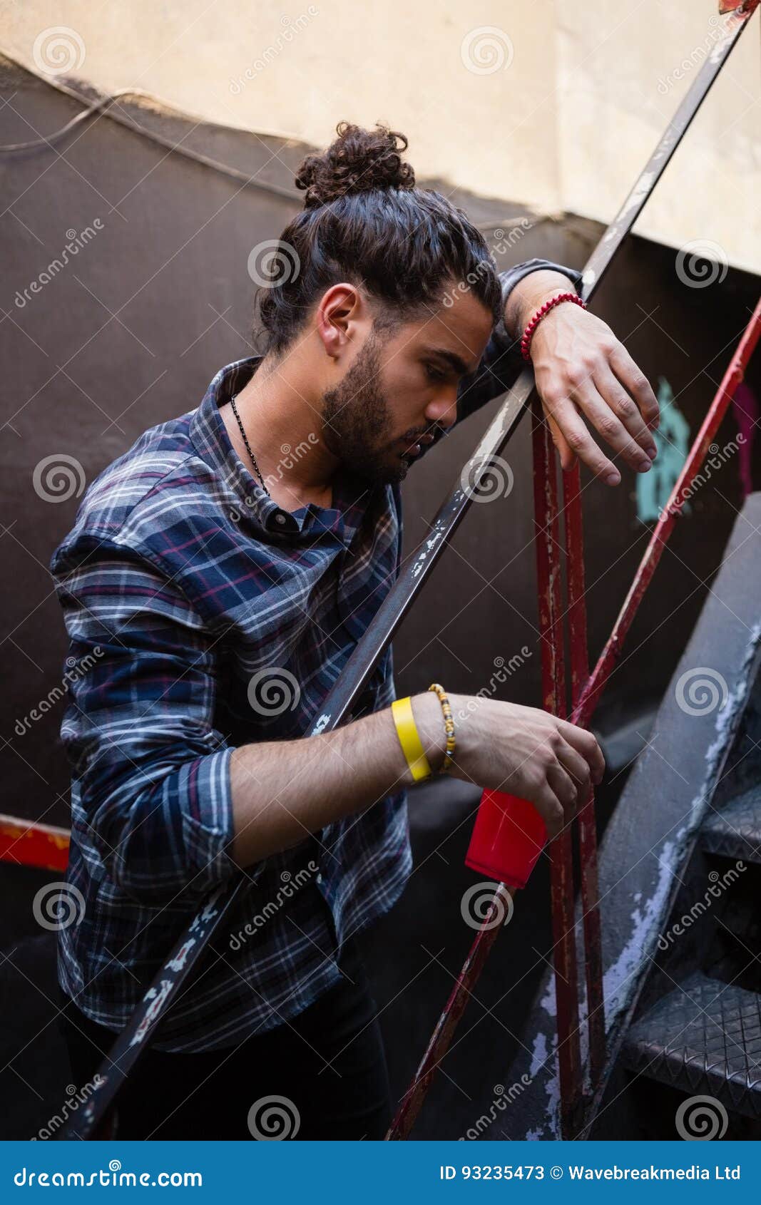 Drunk Man Leaning on Railings Stock Image - Image of habit, clothing ...