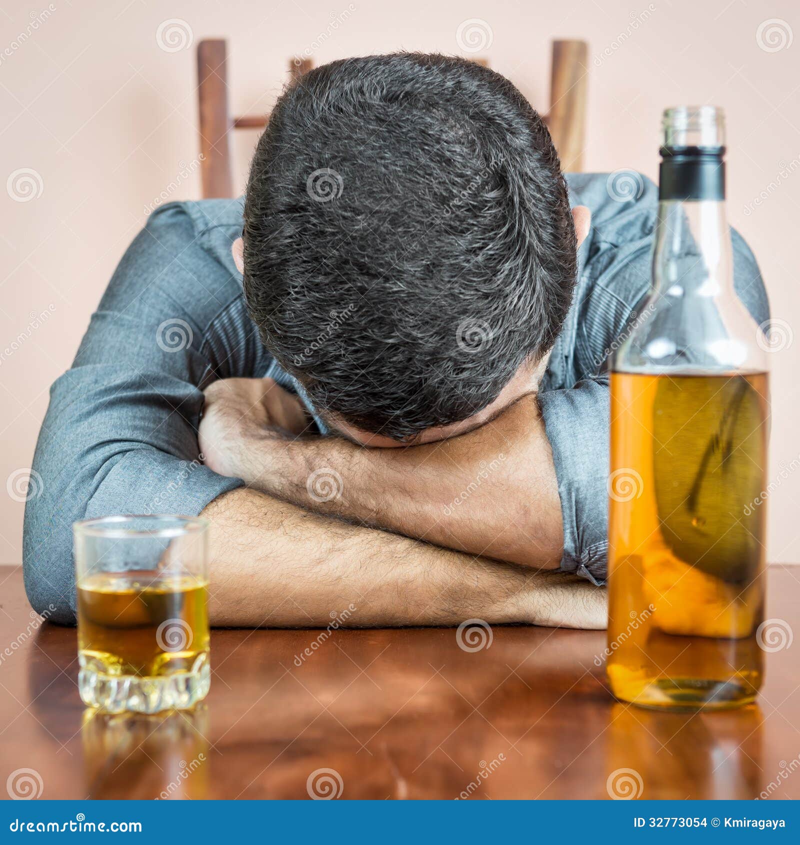 Drunk Man Sleeping With A Whisky Bottle On His Table Royalty-Free Stock ...