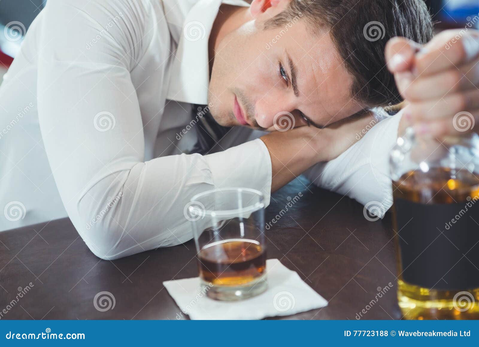 Drunken Man Lying on a Bar Counter Stock Photo - Image of bottle ...