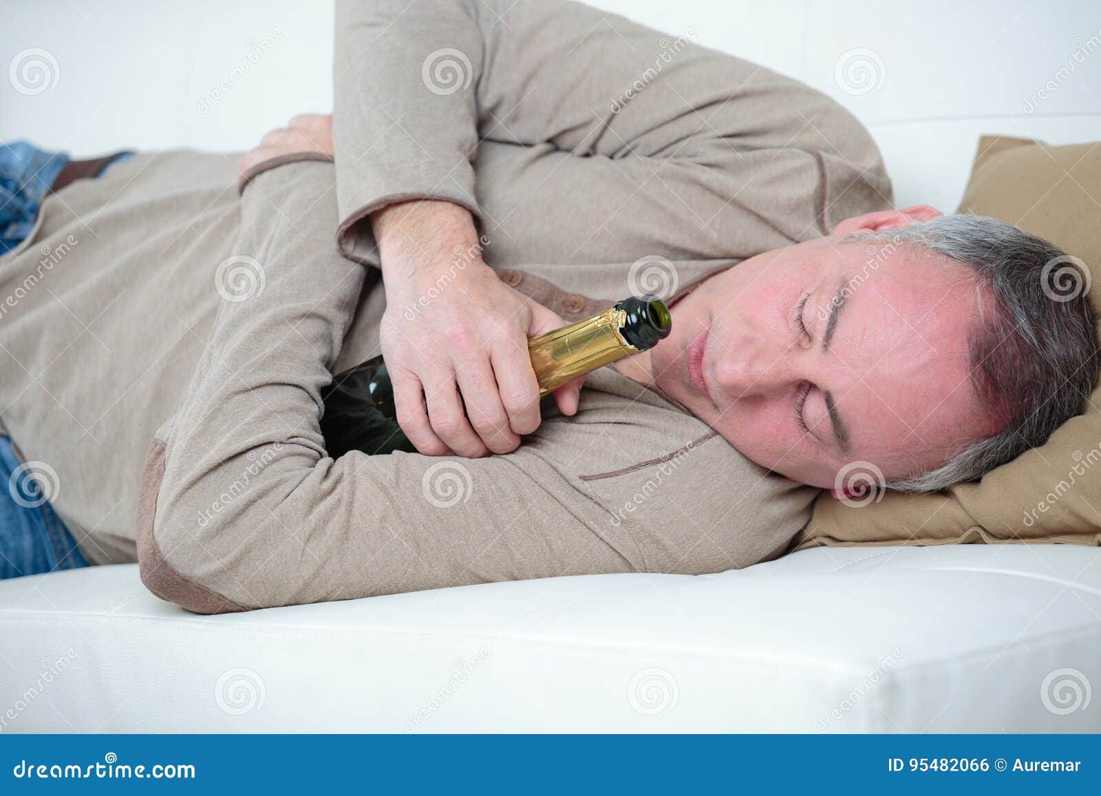 Drunken Man Sleeps Hugging Beer Bottle Stock Photo - Image of holding ...