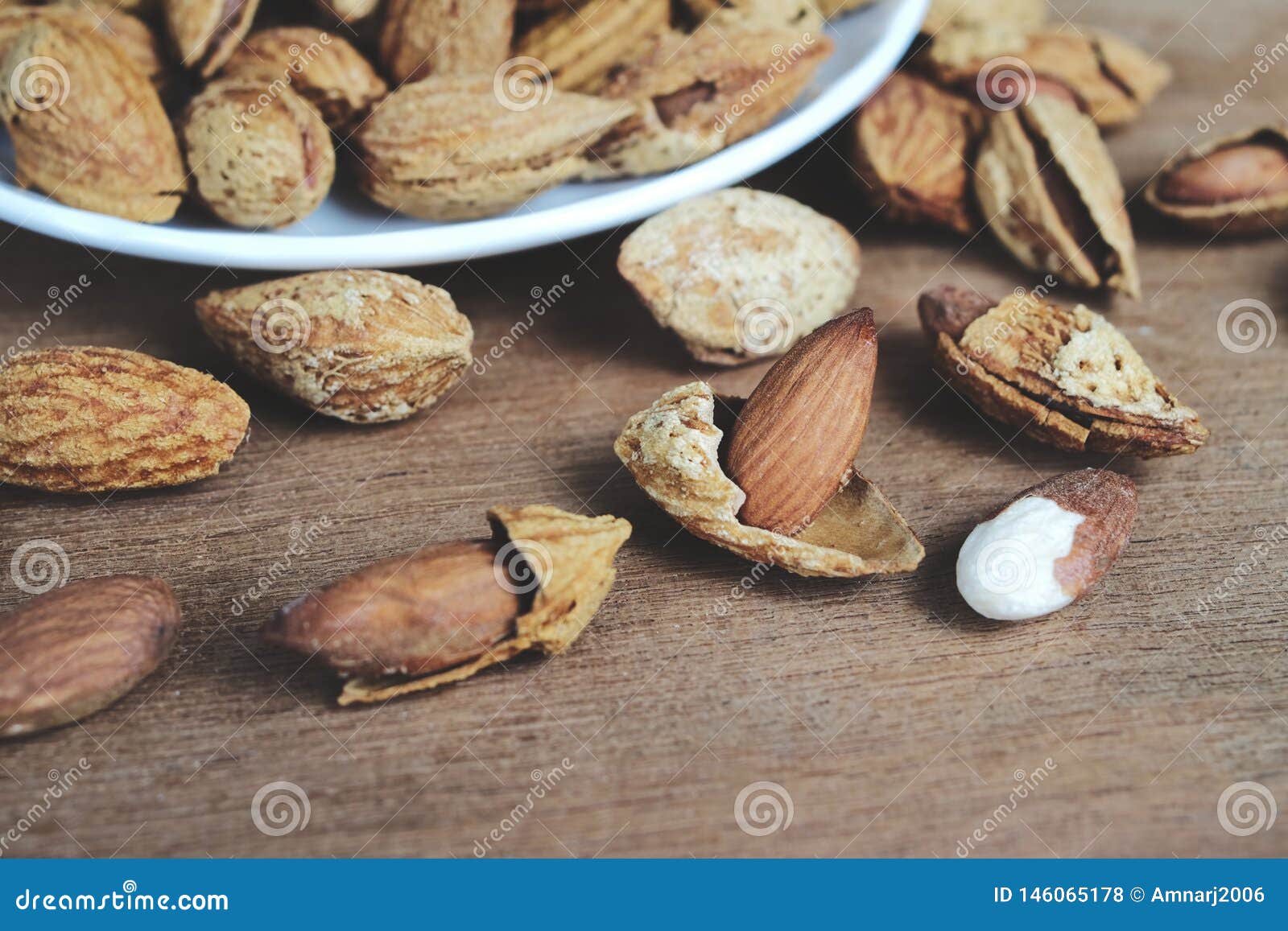 Dry Almonds Nuts with Shell on Wood Table Stock Photo - Image of group ...