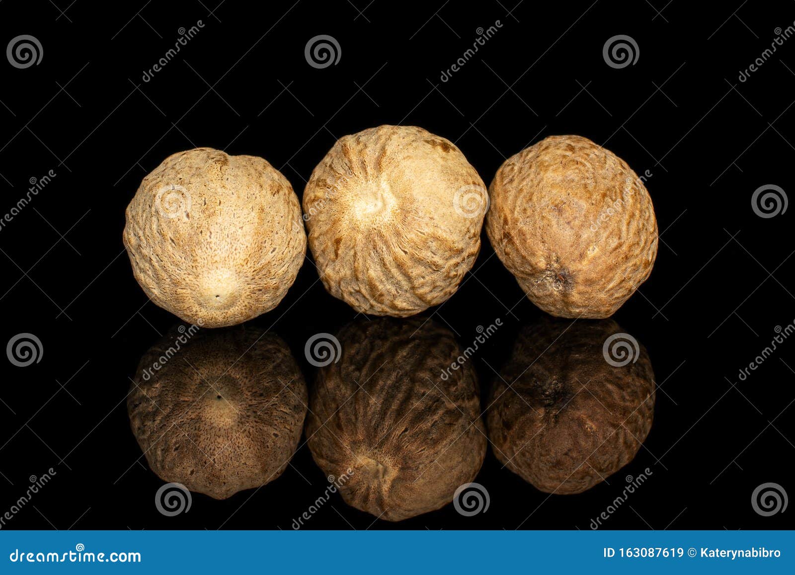 Dry Brown Nutmeg Isolated on Black Glass Stock Image - Image of ...