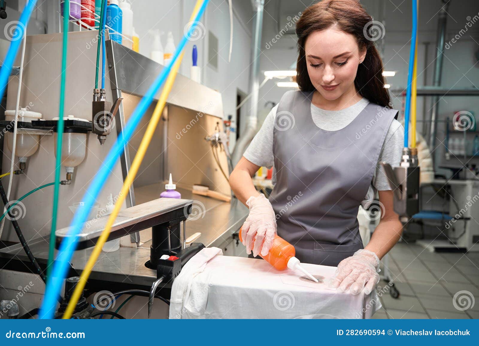 Dry-cleaning Operator Adding Solvent To Spots, Treating Clothes before ...