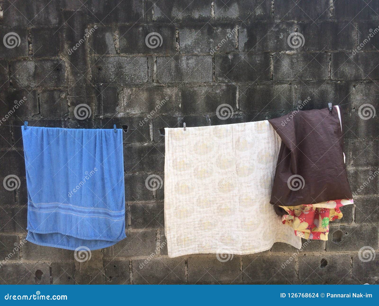 Dry clothes in the sun. stock photo. Image of creative - 126768624