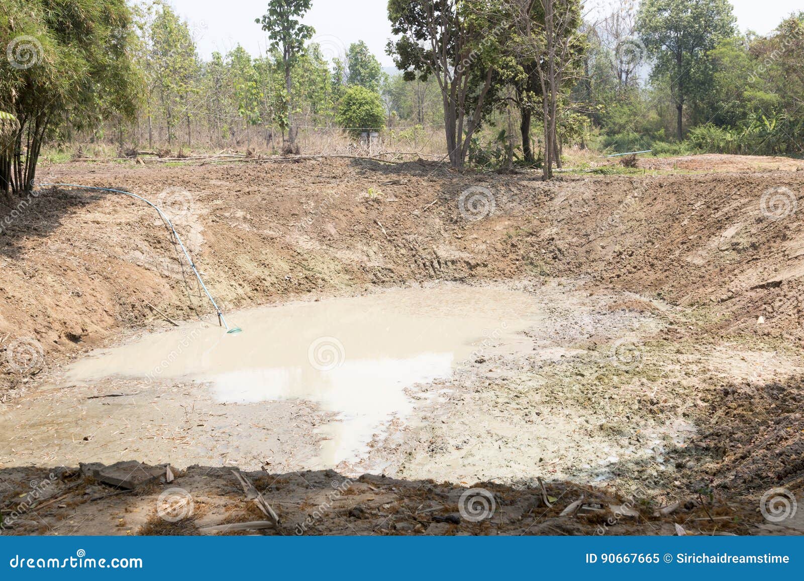 Dry Cracked Land and a Small Water Spot in a Dam Stock Image - Image of ...