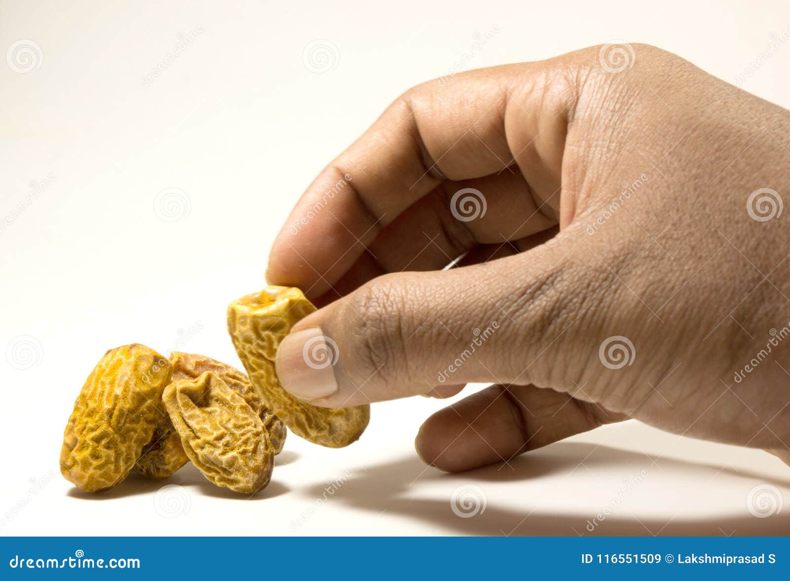Dry Dates Picking with Hand on White Background Stock Image - Image of ...