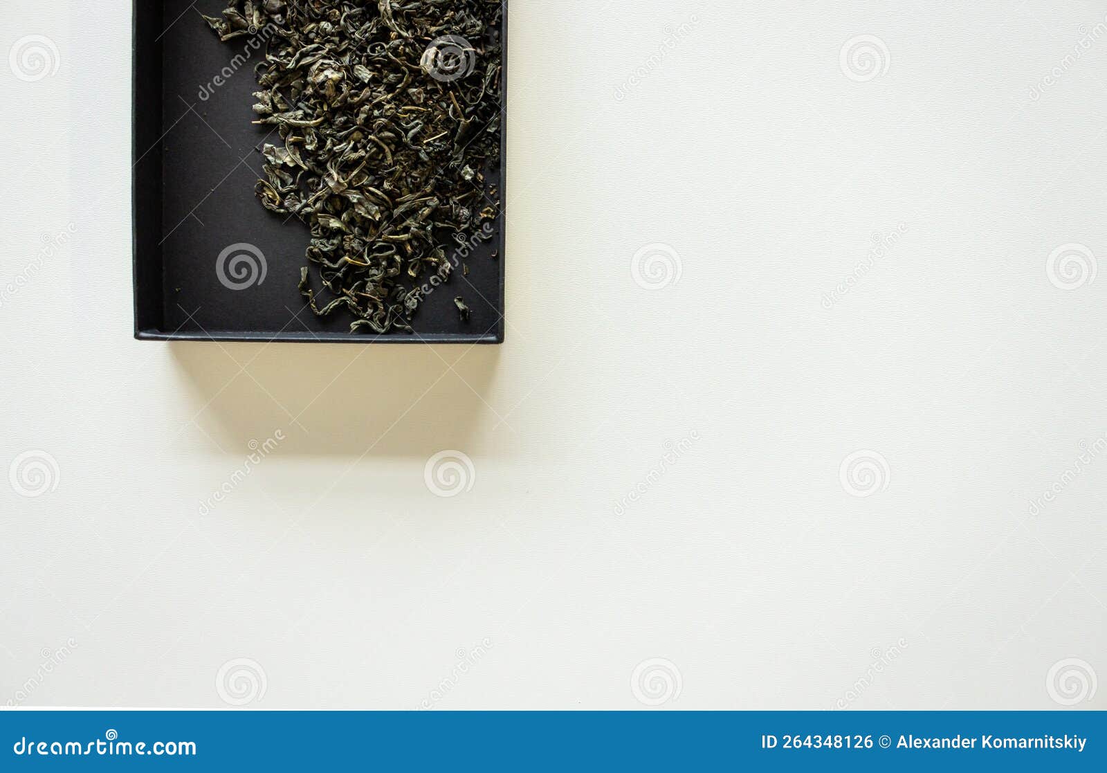 Dry Green Tea Leaves in a Box on a Light Background. Stock Photo ...