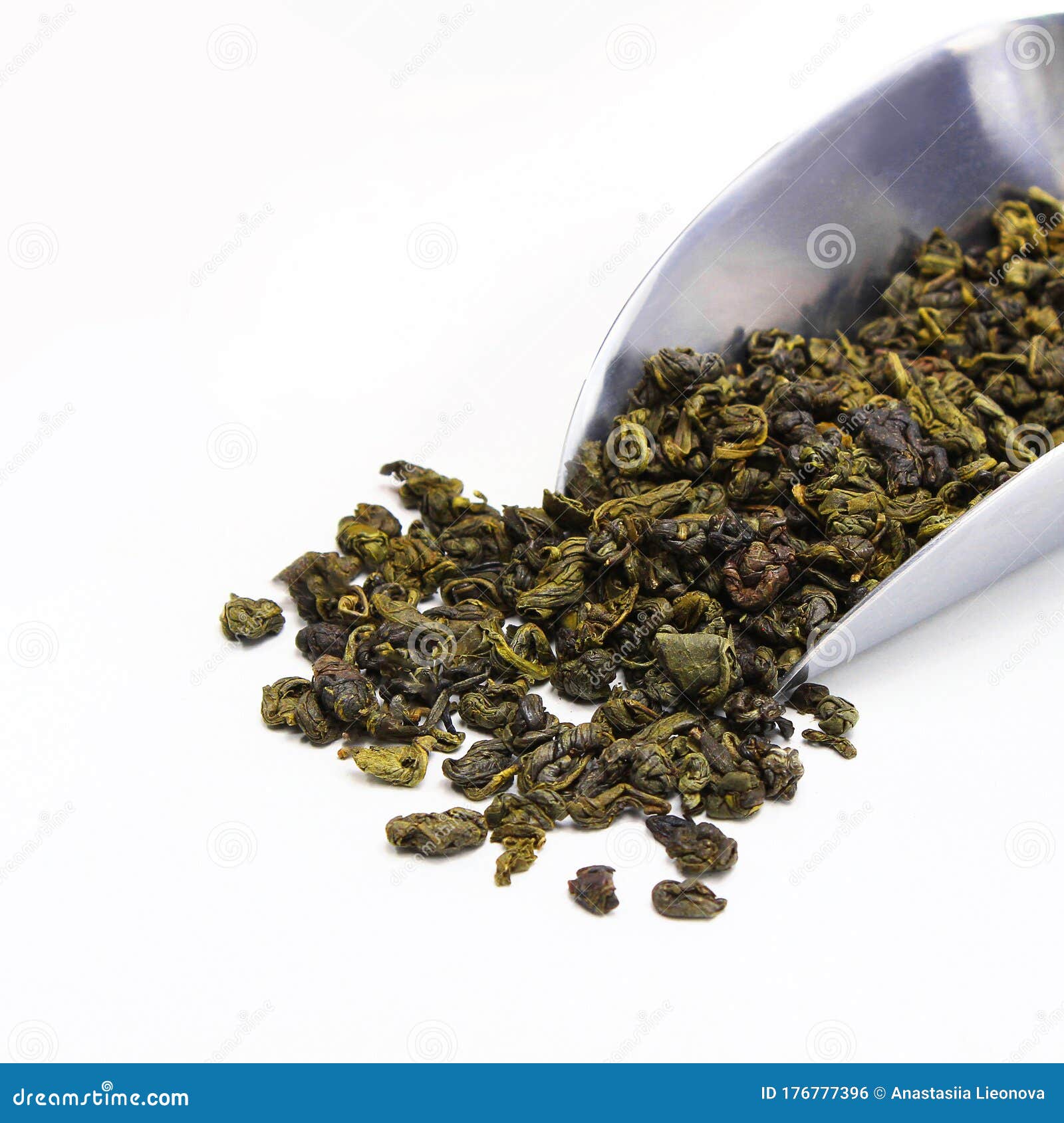 Dry Leaves of Green Tea in Spoon on a White Background. Stock Photo ...