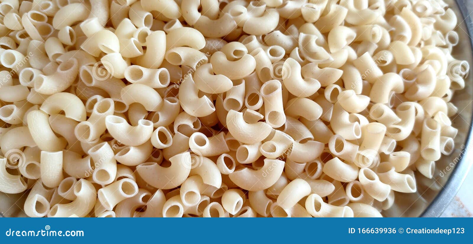 Dry macaroni pasta. stock photo. Image of culture, isolated - 166639936