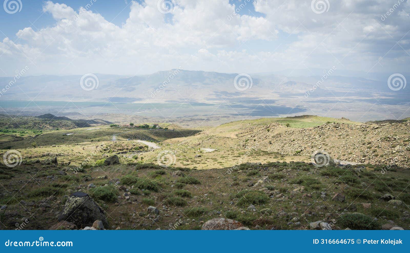 Dry Mountainous Landscape with Small Settlement and Mountain Ranges in ...